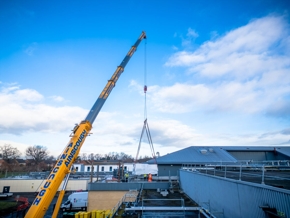 Crane lifts heat pumps onto hospital roof as part of £16.2m project – SaTH